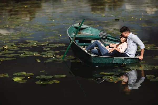 Just relaxing. Beautiful young couple enjoying romantic date while ...