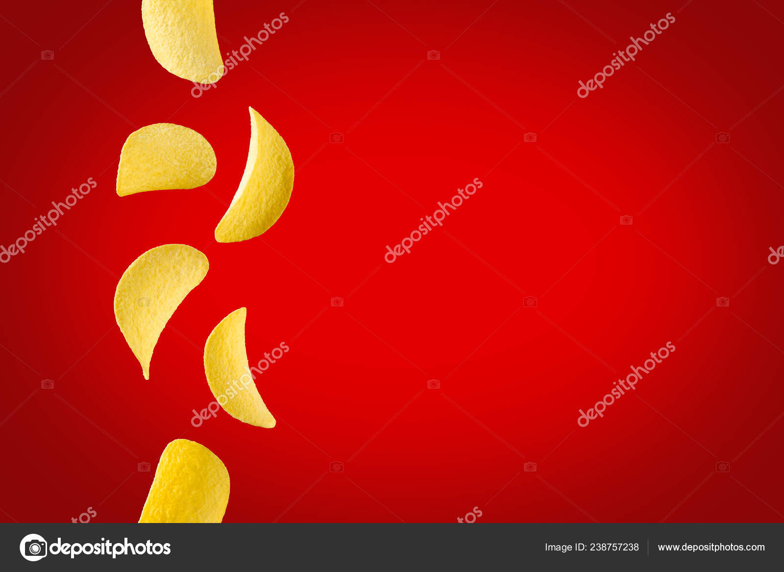 Falling potato chips isolated on red background. Flying crispy snacks ...
