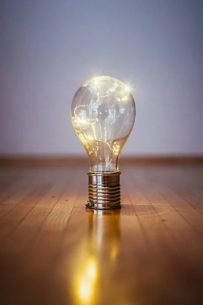 Ideas and innovation: Light bulb with LEDs is lying on a wooden Stock ...