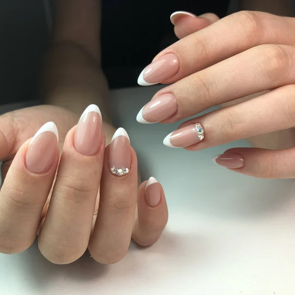 French manicure on the nails.Manicure gel nail polish. Spa and Manicure ...