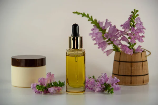 Glass jar with natural face oil and a glass dropper, packaging with ...