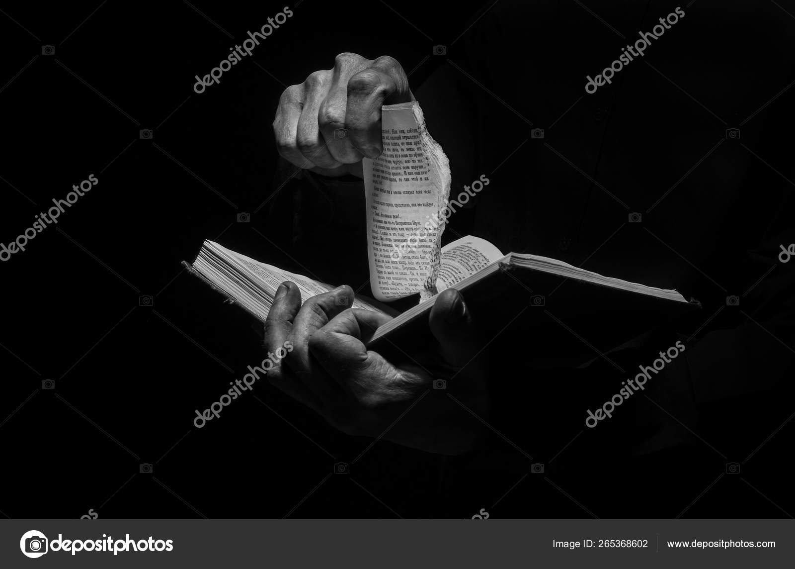 Man tearing a page from the book. Stock Photo by ©mercava2007 265368602