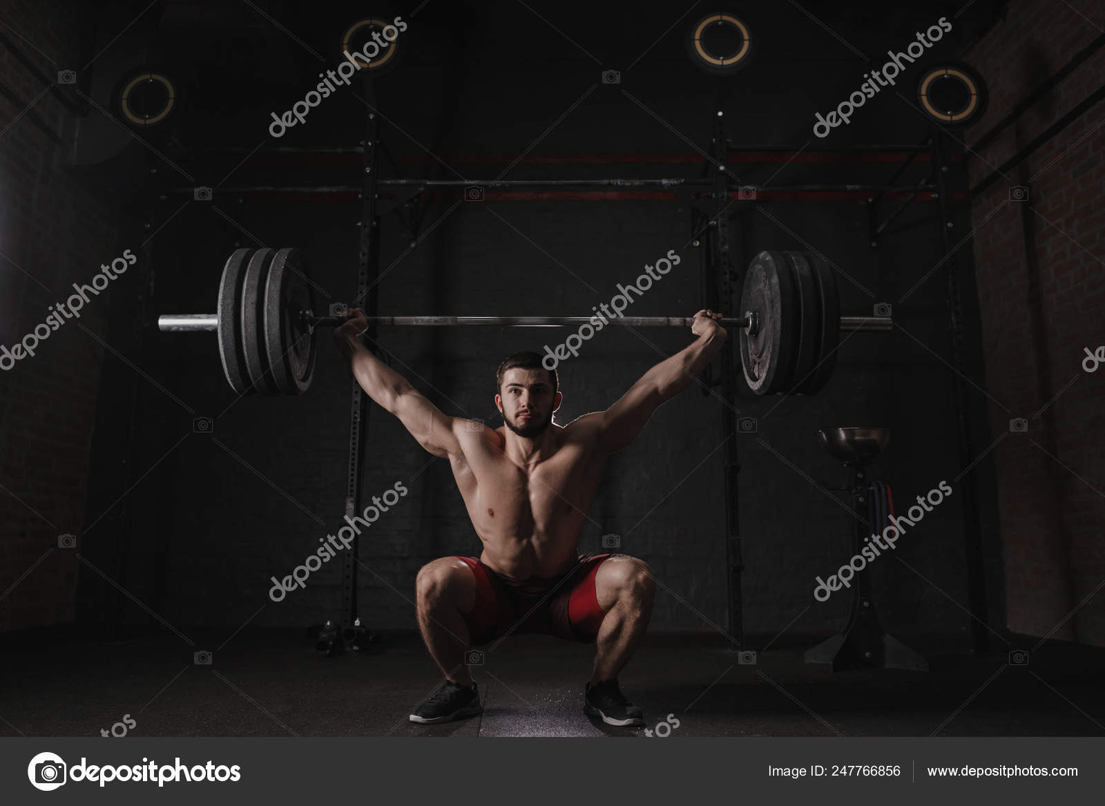Crossfit Athlete Lifting Heavy Barbell Overhead Gym Practicing ...