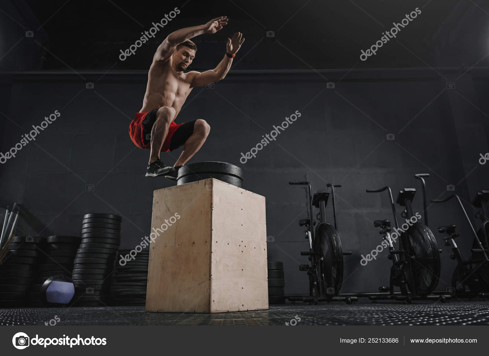 Athlete doing box jump exercise at the crossfit gym — Stock Photo ...