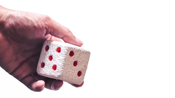 Hand & Rolling Dice. Hand rolls a dices on white isolated background ...
