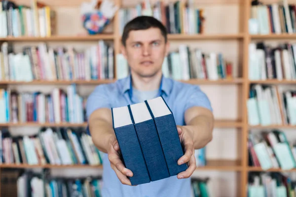 Man holding books Stock Photos, Royalty Free Man holding books Images ...