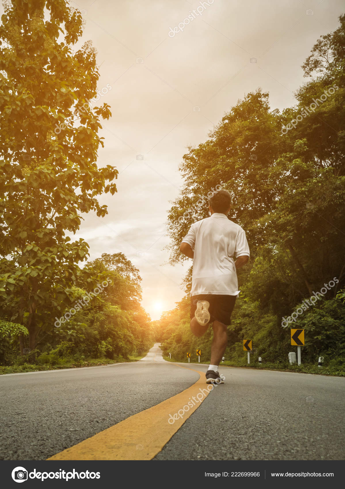 Young Man Running Rural Road Sunset — Stock Photo © aedkaDPS #222699966