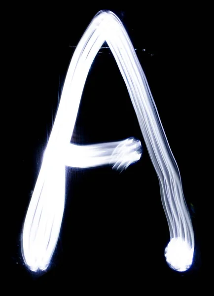 Handwrite letter A, made with light painting technic isolated on black ...