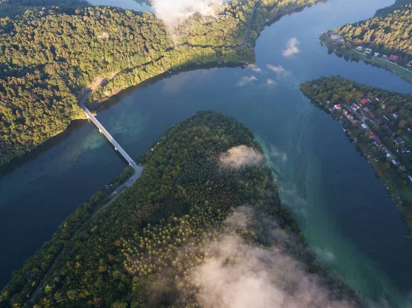 Top view of the river with turns of meanders and green forests in ...