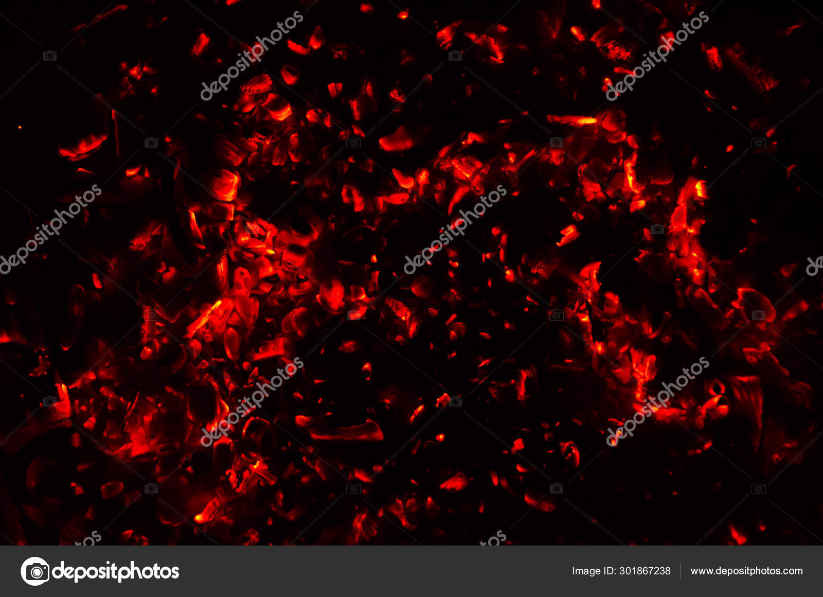 Actively smoldering embers of fire. Background of burning hot coals ...