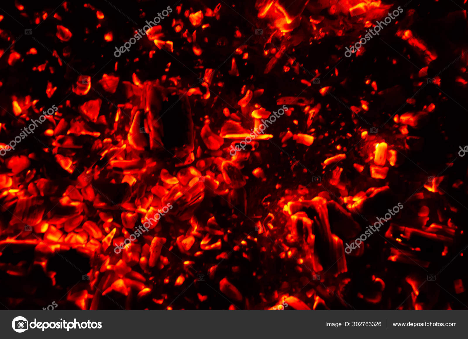 Actively smoldering embers of fire. Background of burning hot coals ...