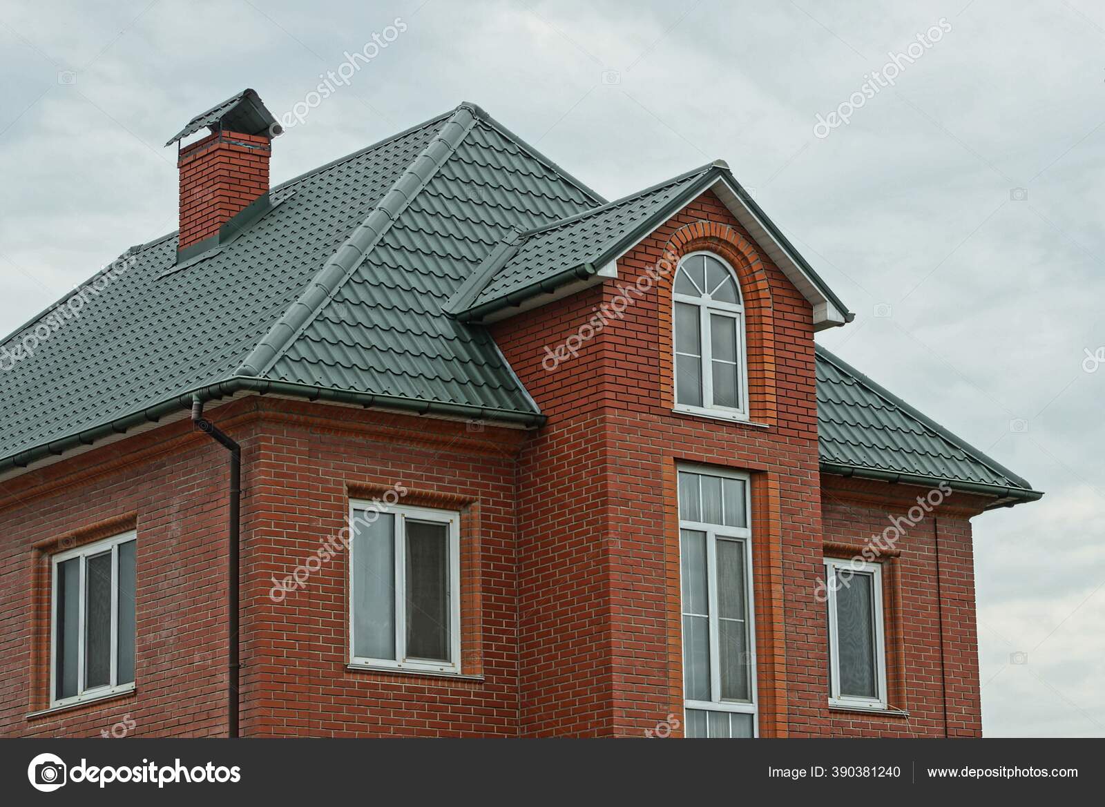 Red Brick House With Green Roof Roofs—Sustainability