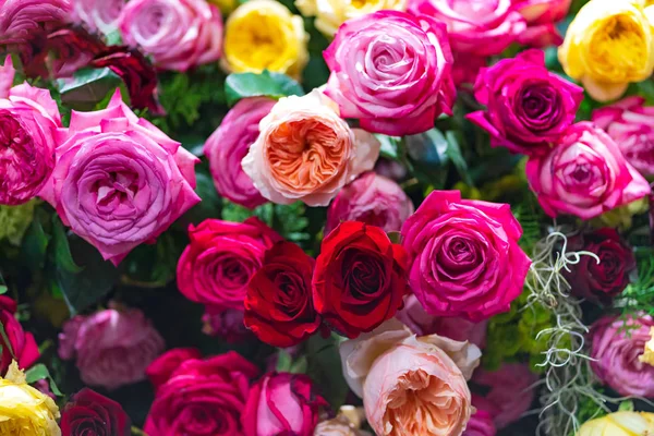Mixed multi colored roses in floral decor, Colorful wedding flowers ...