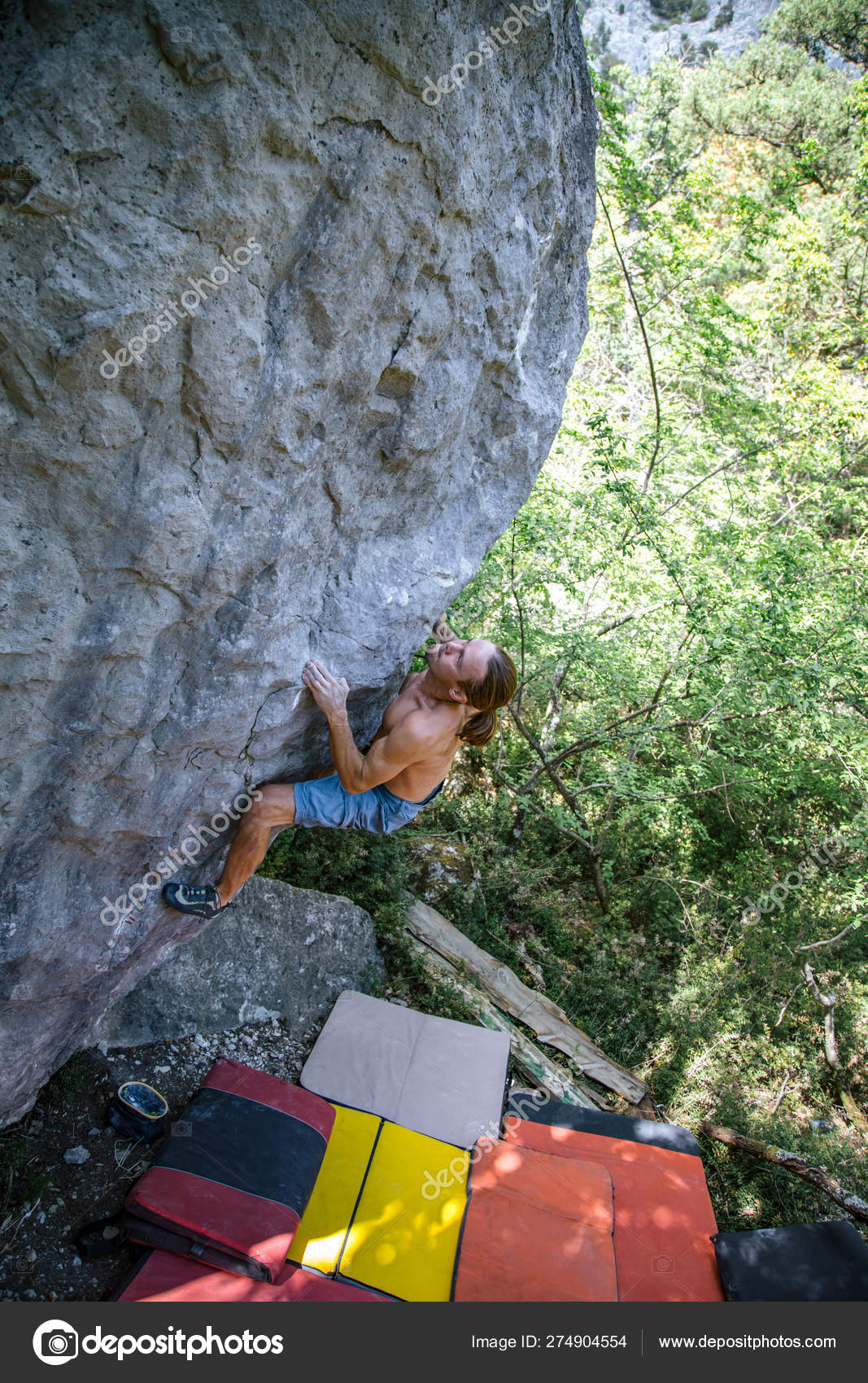 Man climbing boulder. — Stock Photo © GolubtsovaAlex #274904554