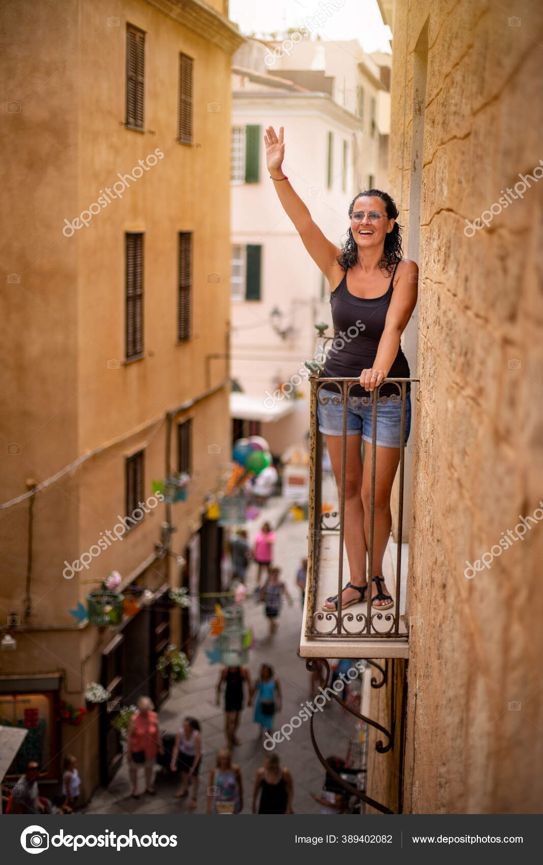 Woman Waving Her Hand Balcony — Stock Photo © Studio_GLC #389402082
