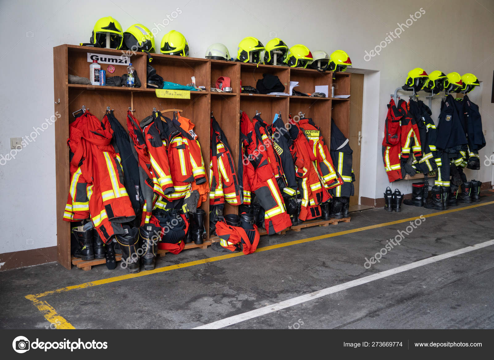 The uniforms of firefighters hang ready for action on the wardro ...