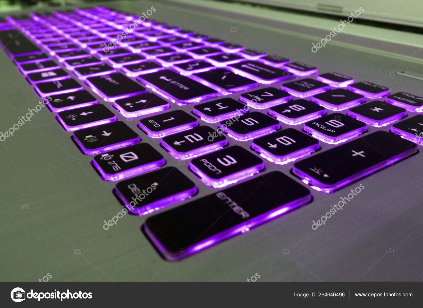 Closeup of laptop keyboard illumination, backlit keyboard. Gaming ...