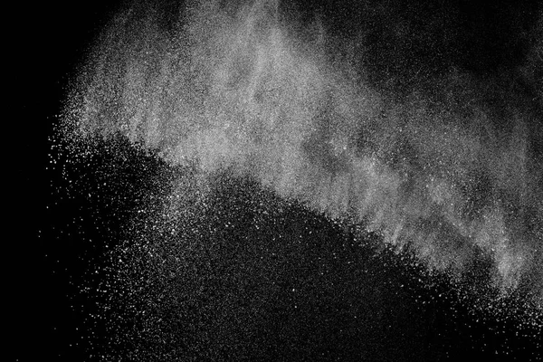 Freeze motion of white particles on black background. Powder explosion ...