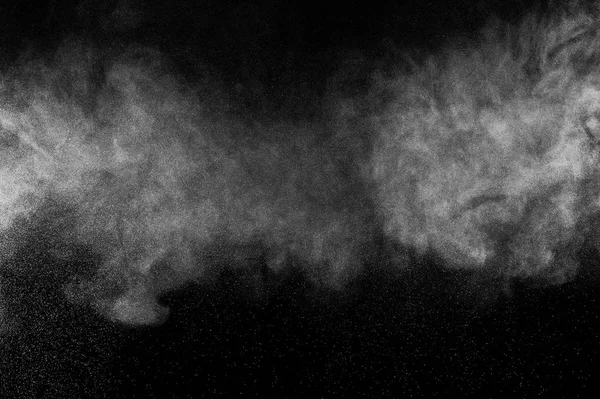 Freeze motion of white particles on black background. Powder explosion ...