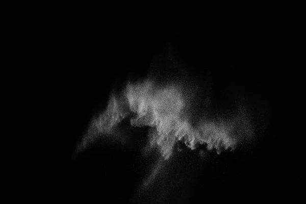 Freeze motion of white particles on black background. Powder explosion ...