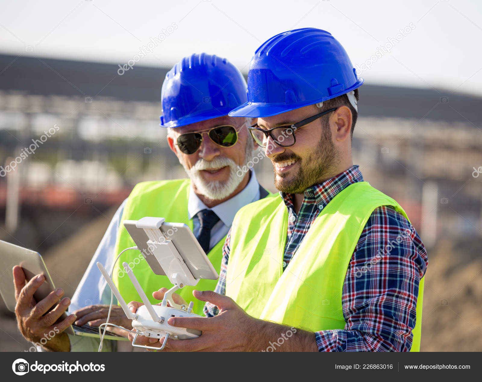 Two Engineers Helmets Vests Operating Drone Remote Control Technology ...