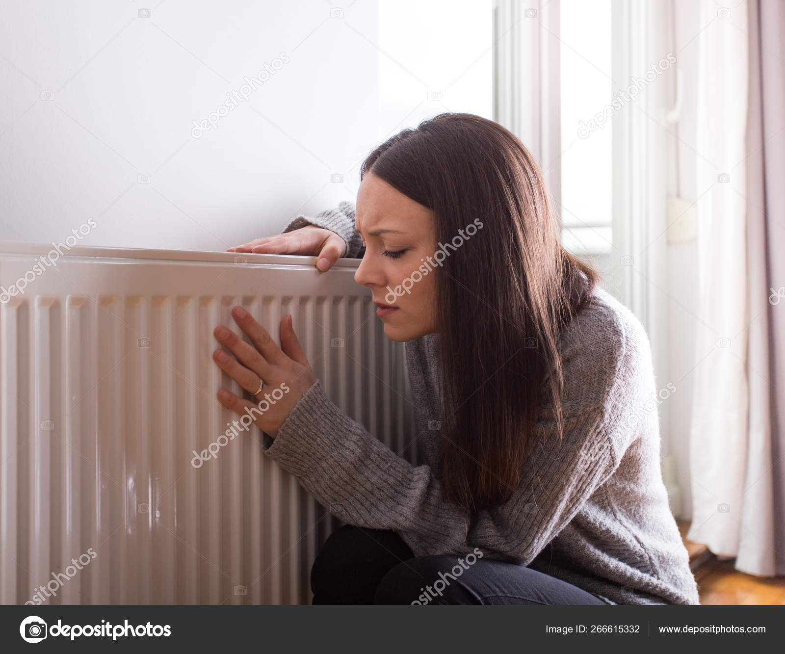 Girl beside radiator Stock Photo by ©budabar 266615332