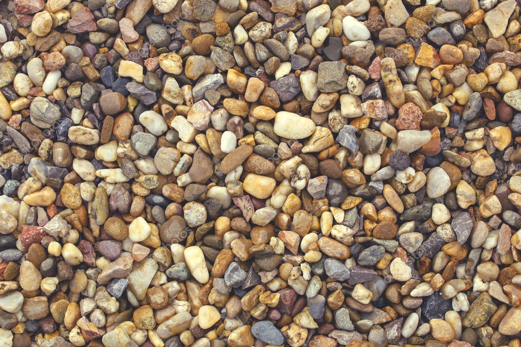 Fondo de piedra de guijarro, vista superior de primer plano de piedras ...