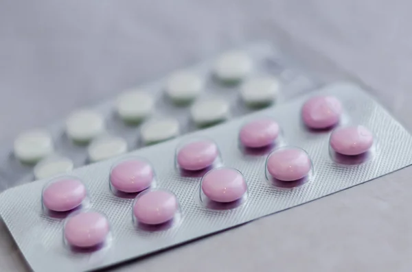 Pills for flu in the package close-up. The concept of treating colds ...