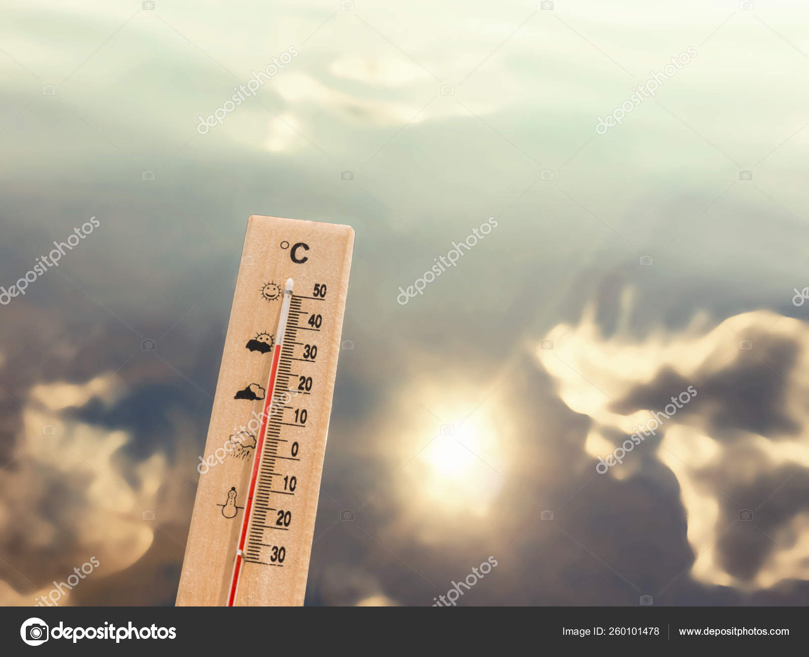 Thermometer showing 30 degrees of heat against the backdrop of lake ...