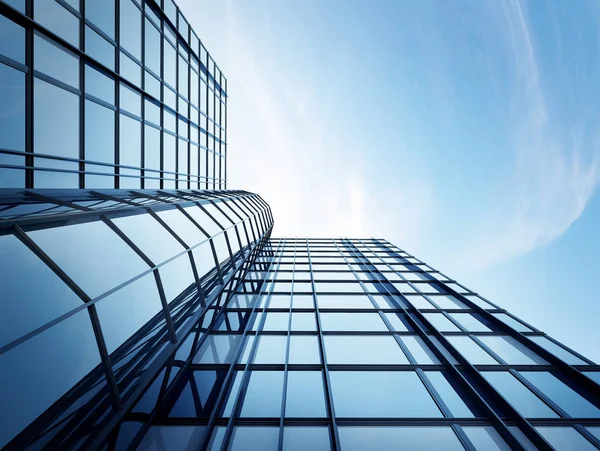 View of high rise glass building and dark steel window system on blue ...