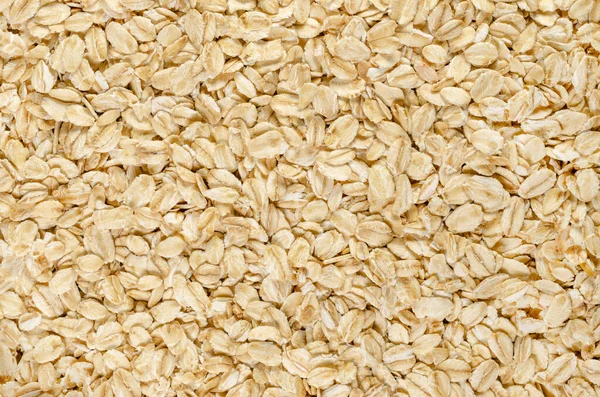 Rolled oats, close-up. Lightly processed whole-grain food. Husked and ...