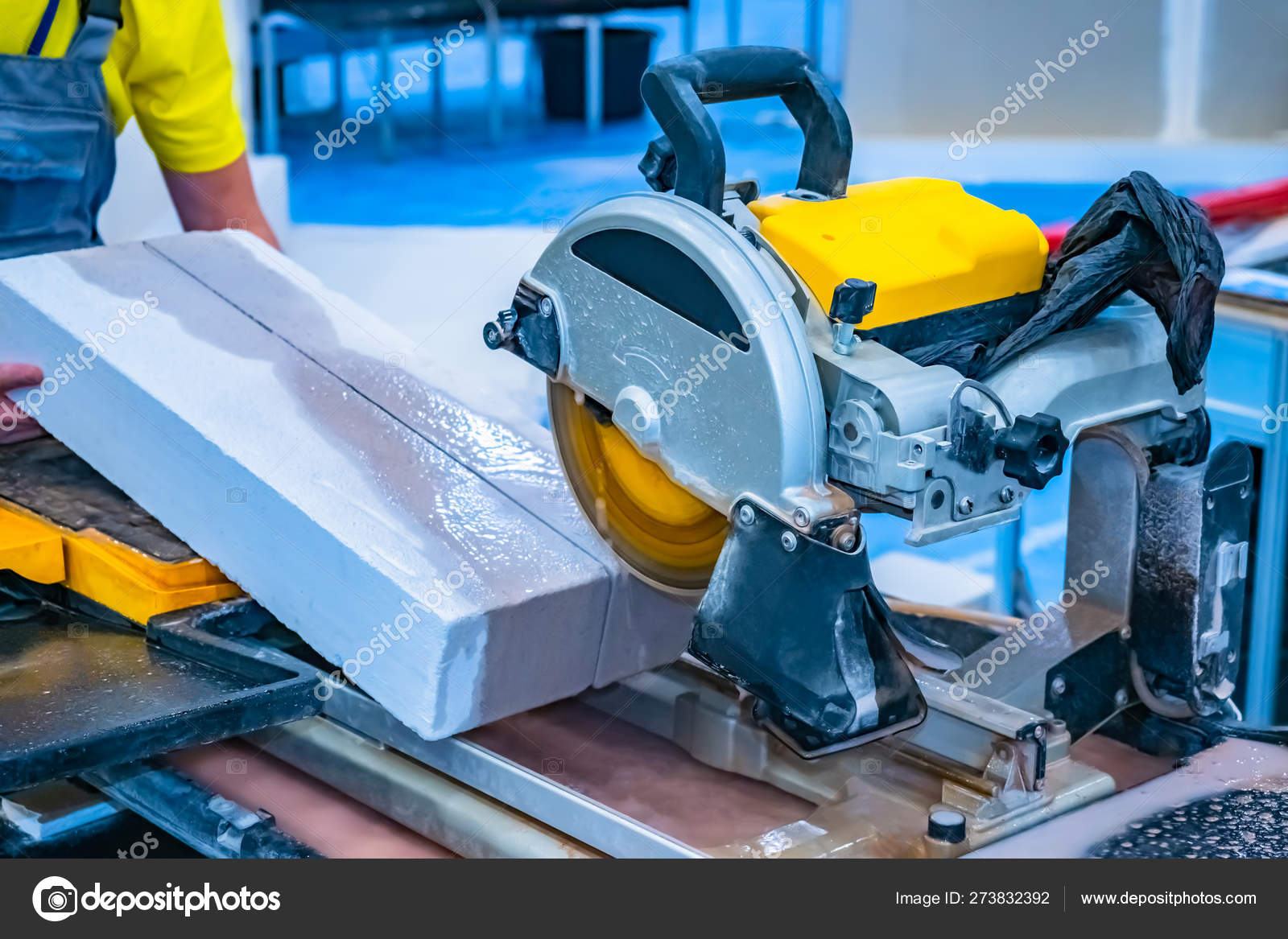 A man sawing concrete. Construction works. Cutting saw. Worker sawing ...