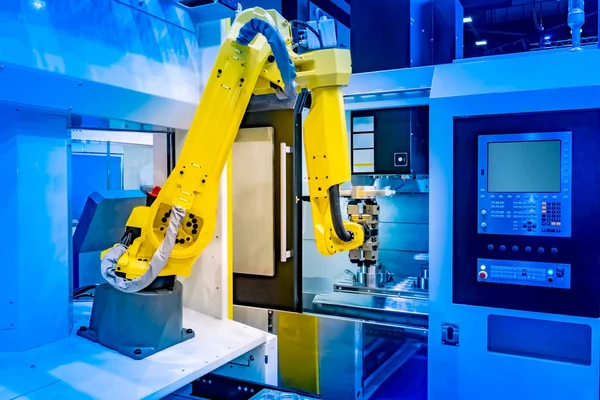 Robot in production. Robotic arm. A computer program manages the ...