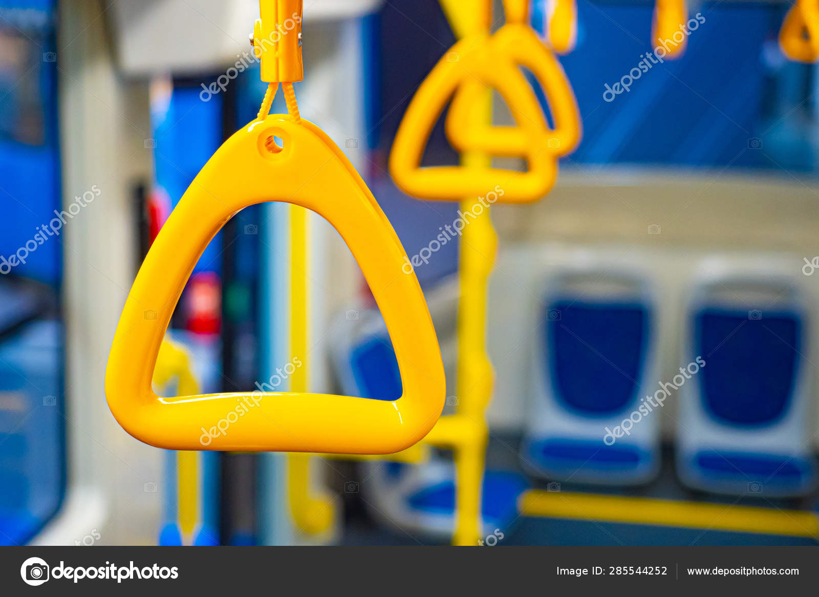Passenger transport interior. Triangular plastic handles for pas ...