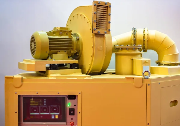 Yellow air handling unit. Ventilation in the workplace. Air intake and ...