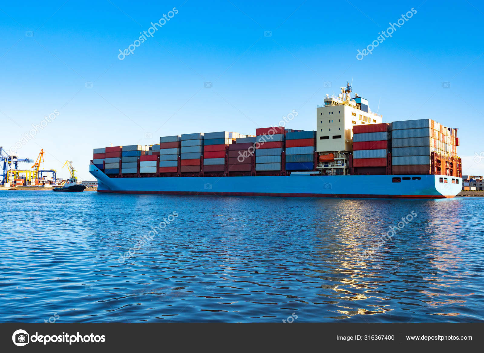 Cargo ship leaves the port. Container ship on a background of blue ...