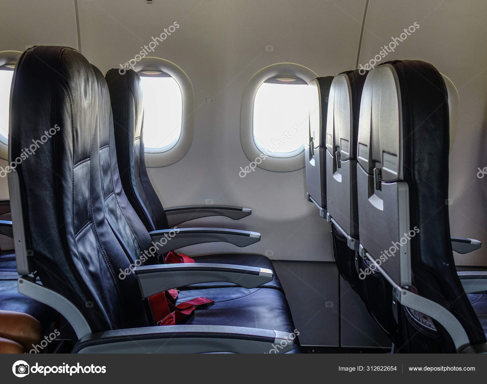 Empty airplane with black chairs Stock Photo by ©phuongphoto 312622654