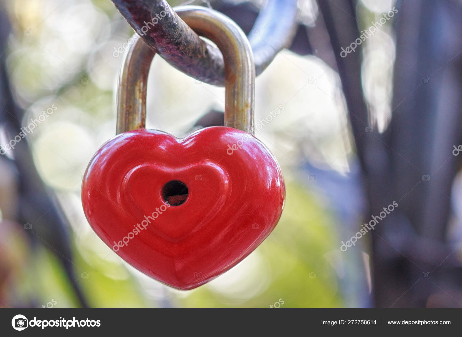 Red lock in the form of a heart hangs on an iron rail. Stock Photo by ...