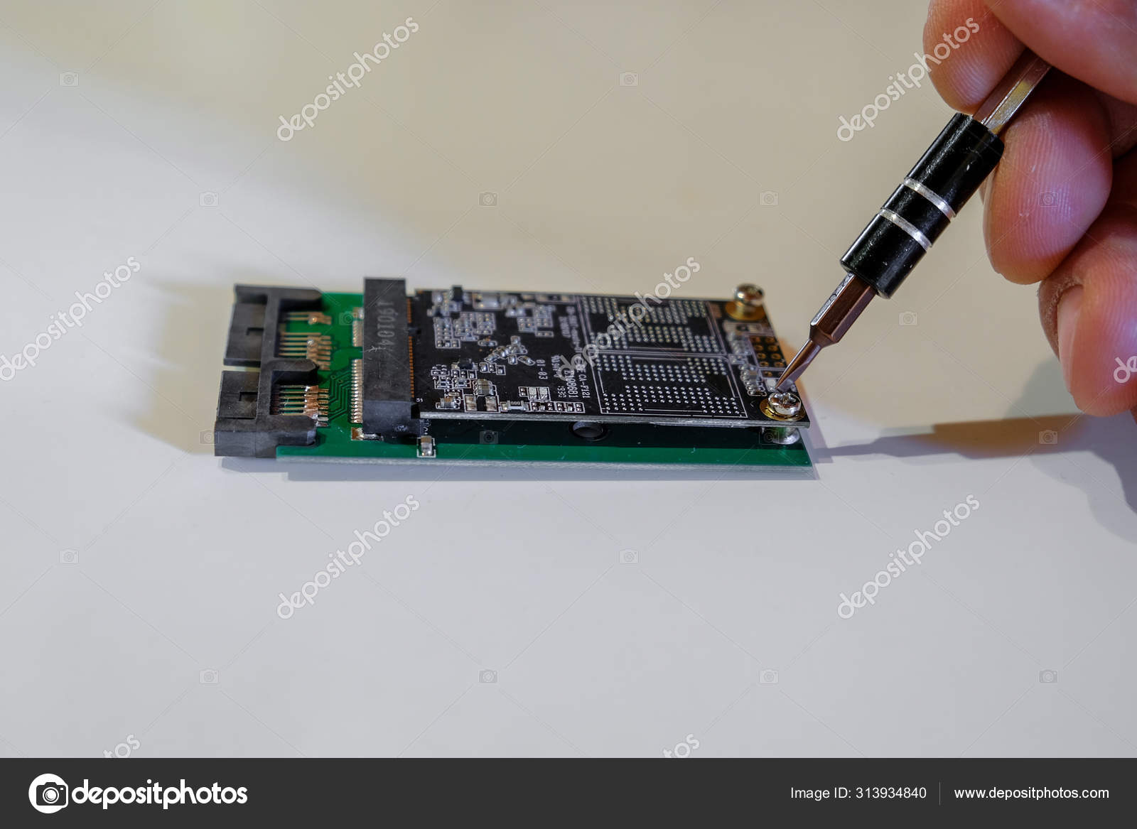 Human hand working on ssd chipset replace computer components with ...