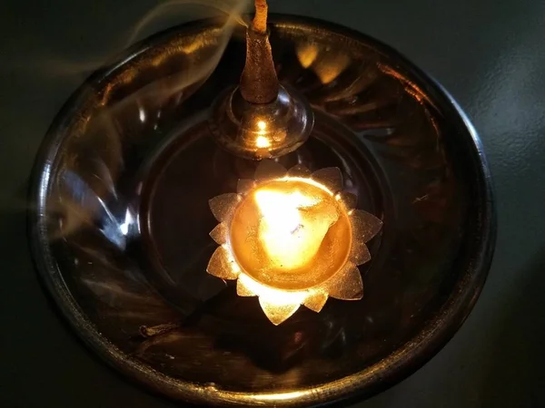 A picture of steel lamp radiating light in dark background - Stock ...