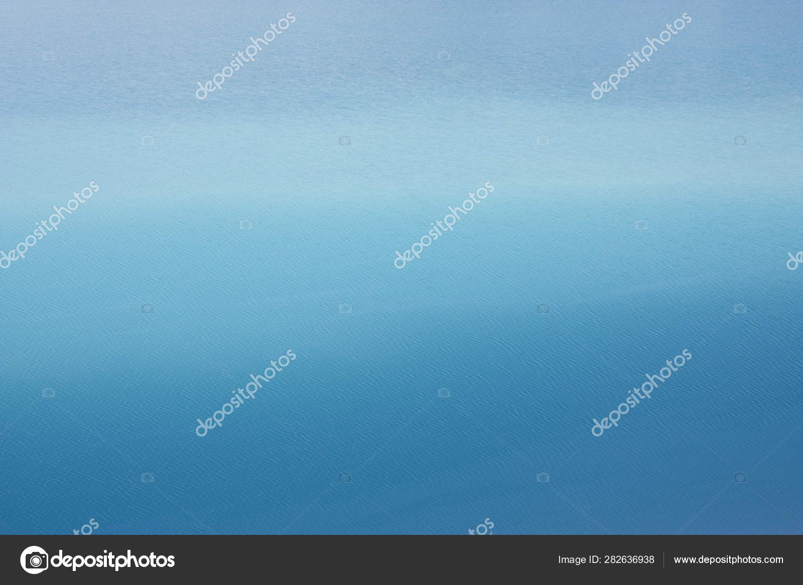 Background azure blue expanse of the sea with small ripples on t ...
