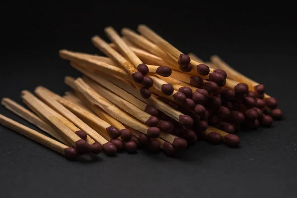 Match sticks accumulated on top of each other. Match sticks and black ...