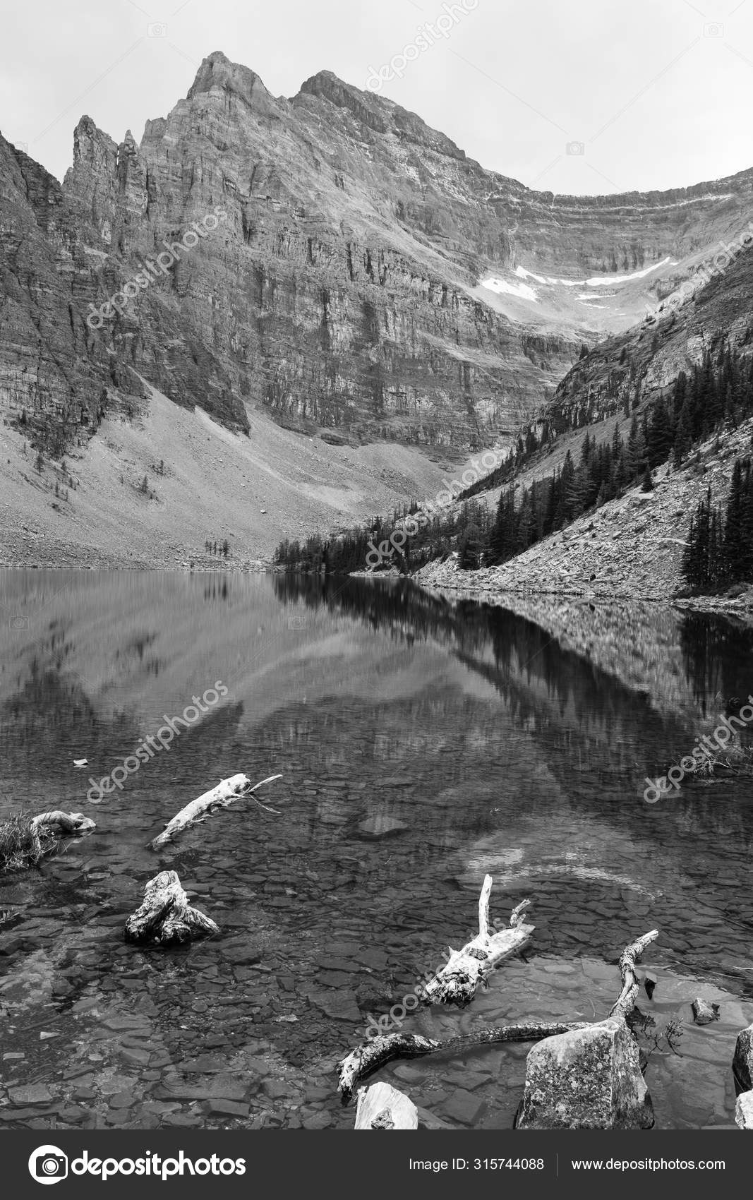 A portrait low level photo of Lake Agnes at Banff National Park, Canada ...