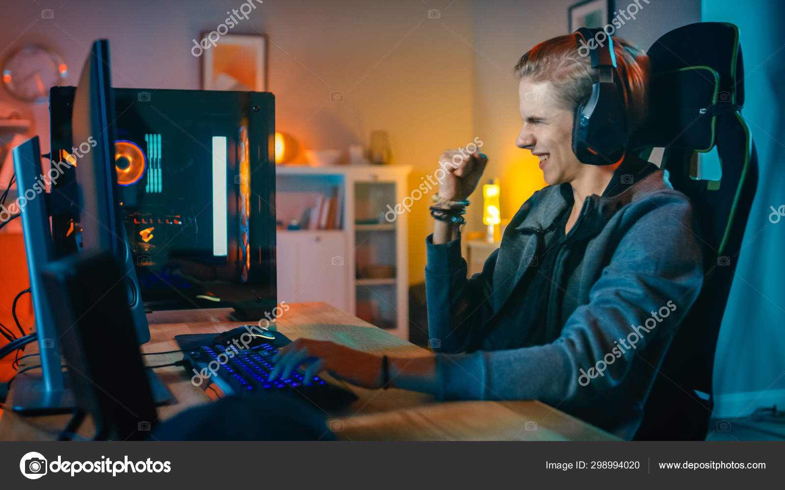 Excited Gamer Playing and Winning in First-Person Shooter Online Video ...