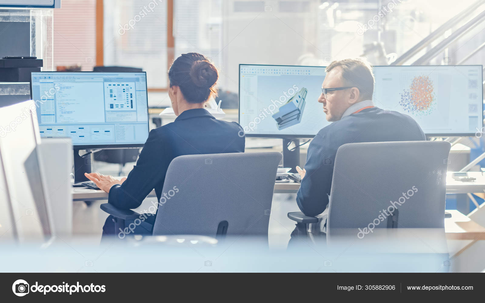 Back View of Team of Technology Engineers Working on Desktop Computers ...