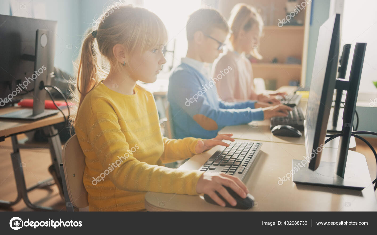 Elementary School Computer Science Classroom: Cute Little Girl Uses ...