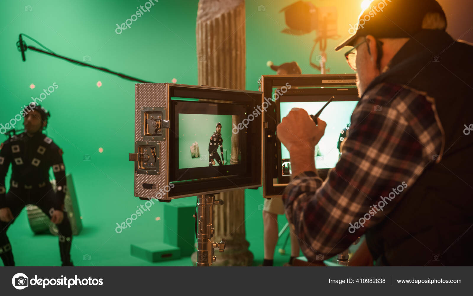 Director Looks at Displays Directs Green Screen CGI Scene with Actor ...