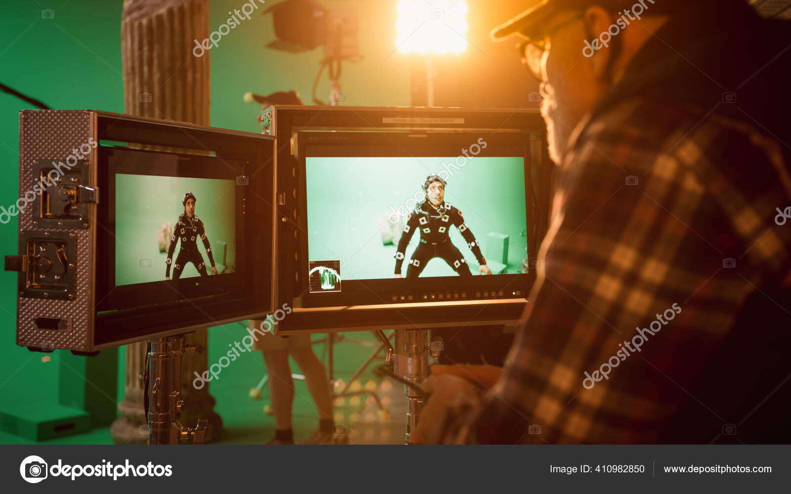 Director Looks at Displays Directs Green Screen CGI Scene with Actor ...