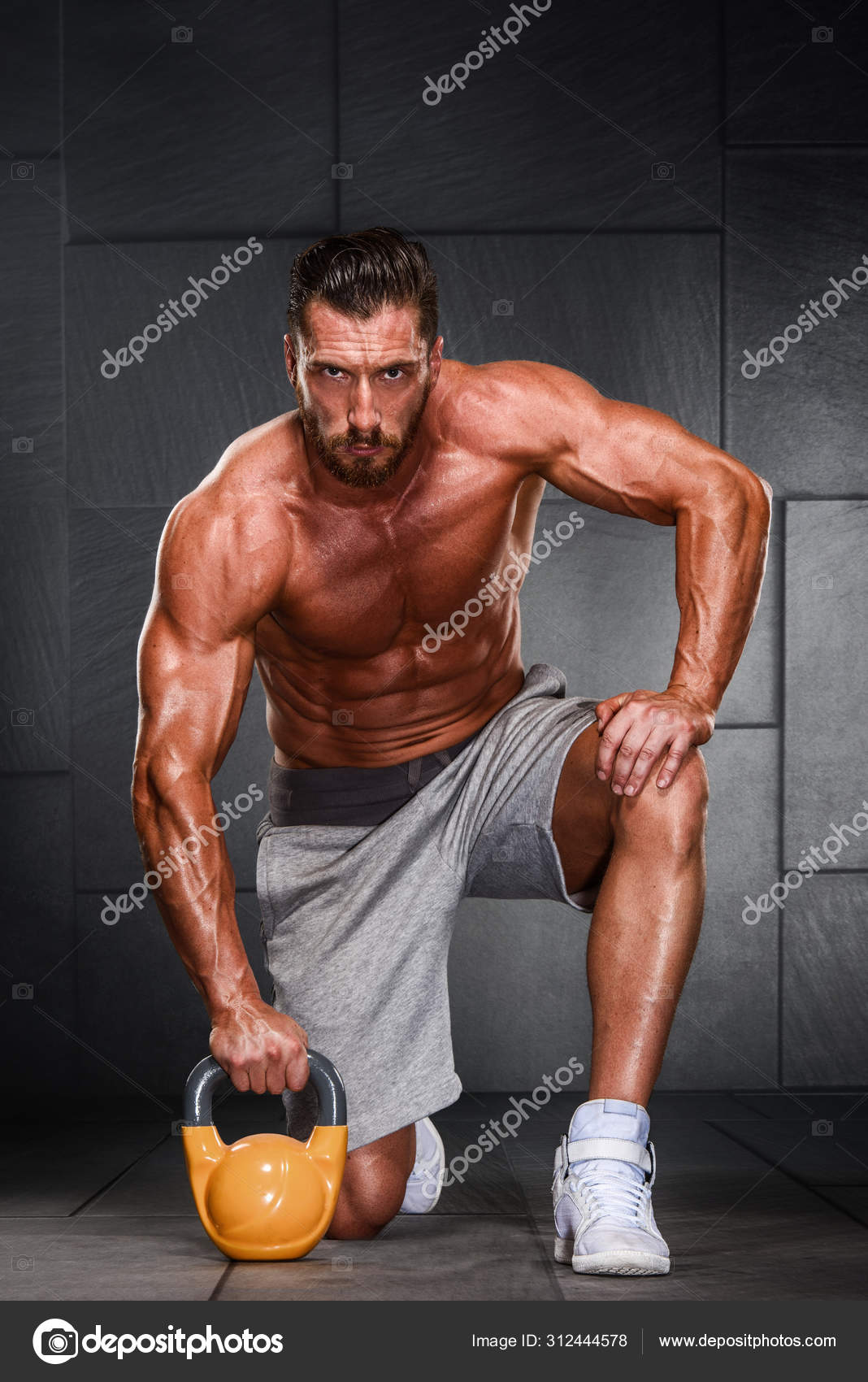 Strong Muscular Men Exercise With Kettlebell — Stock Photo © mrbigphoto ...