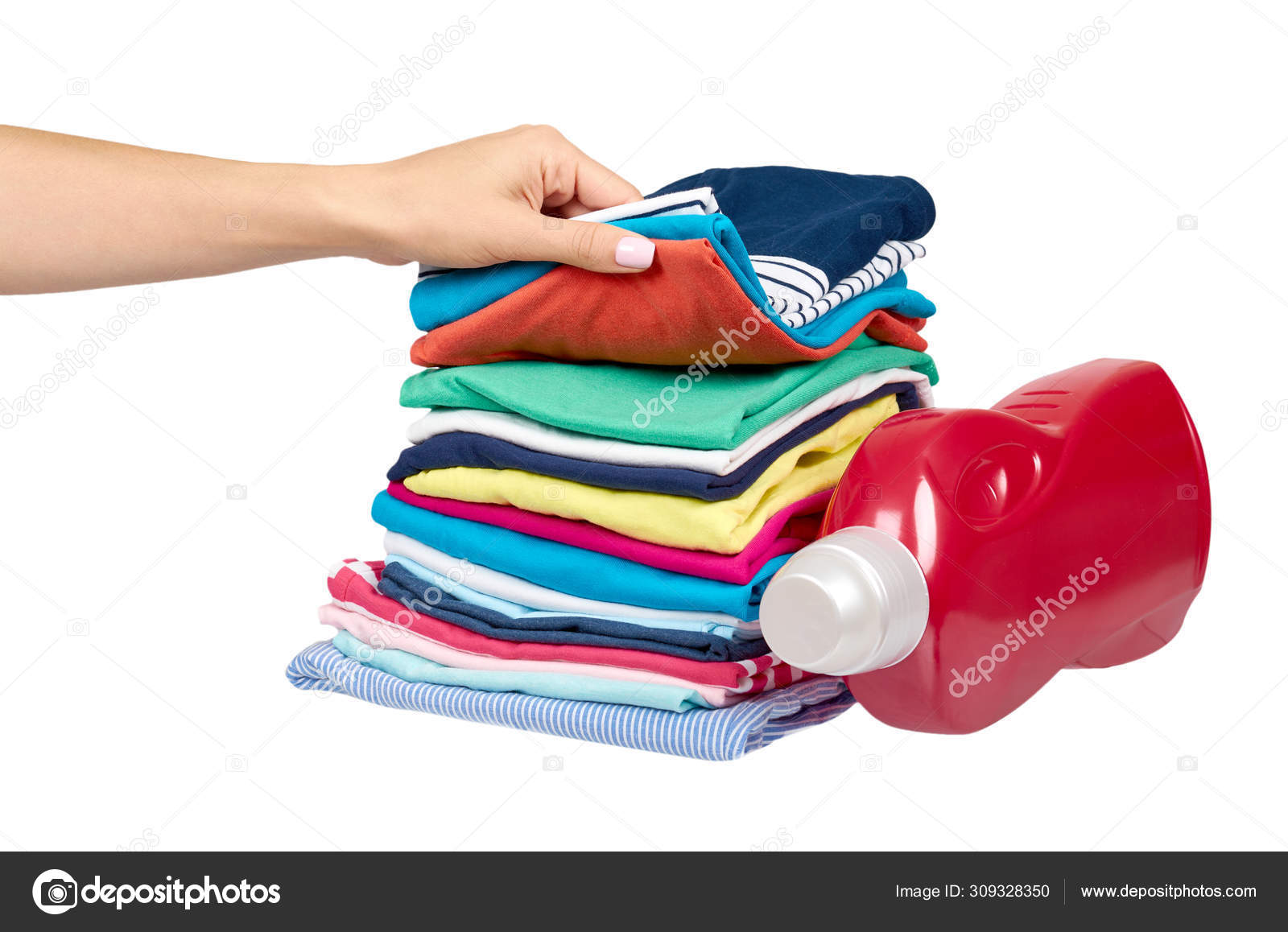 Hand with stack of clothes and detergent bottle, fresh laundry textile ...